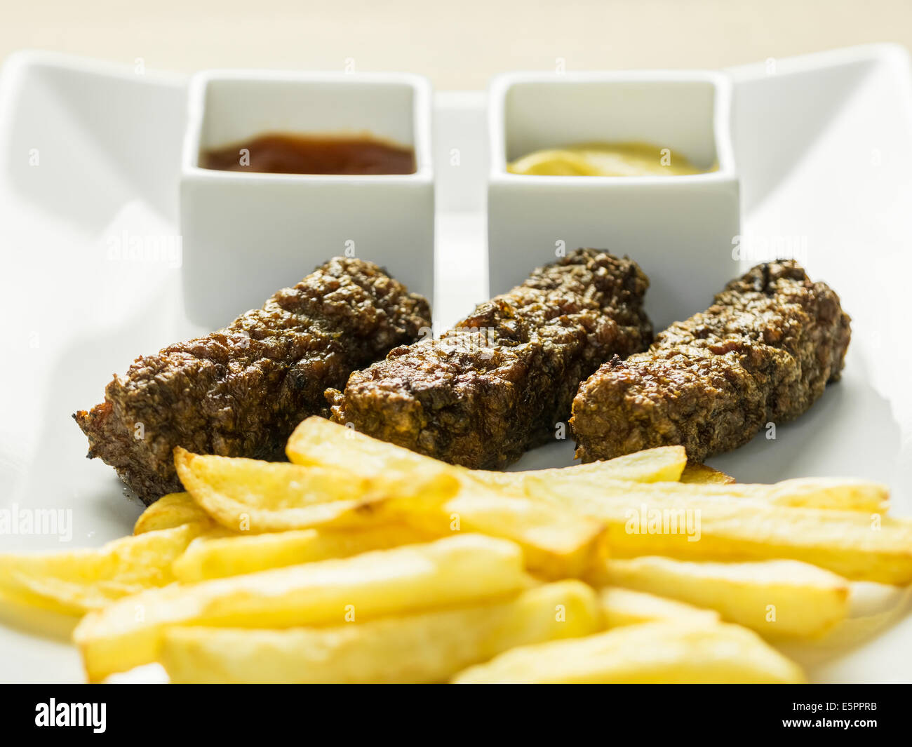 Traditional Romanian Mici And French Fries With Ketchup And Mustard ...