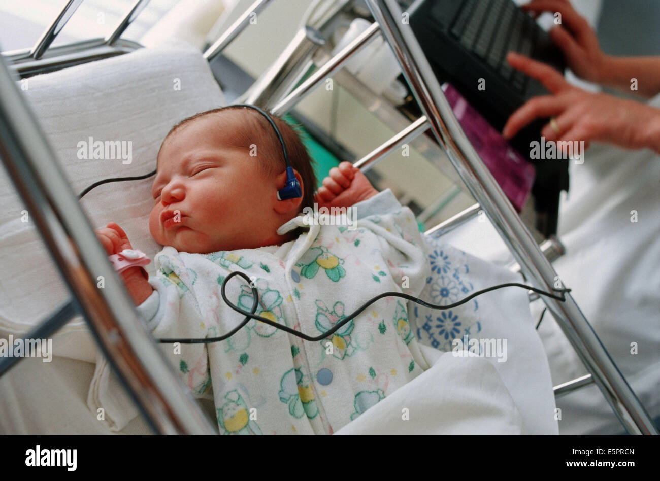 Audiometric test : newborn baby undergoing deafness screening test ...