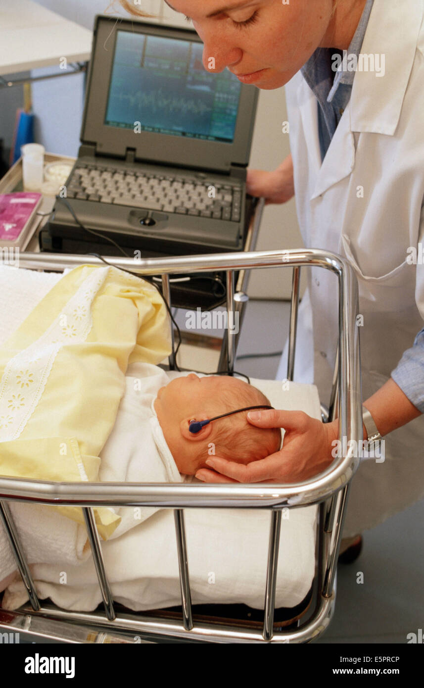 Audiometric test : newborn baby undergoing deafness screening test ...