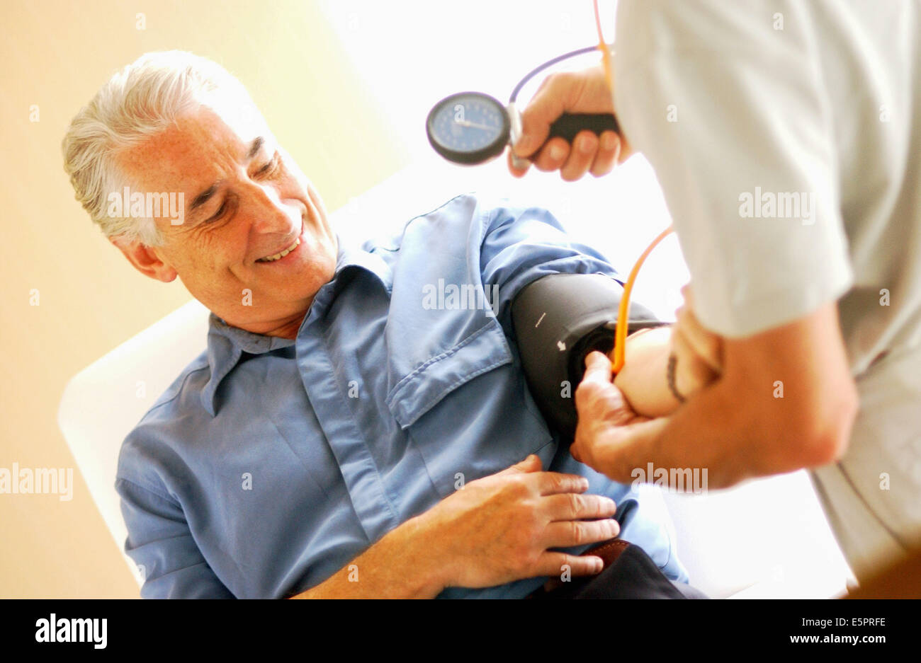 Blood pressure taking Stock Photo - Alamy