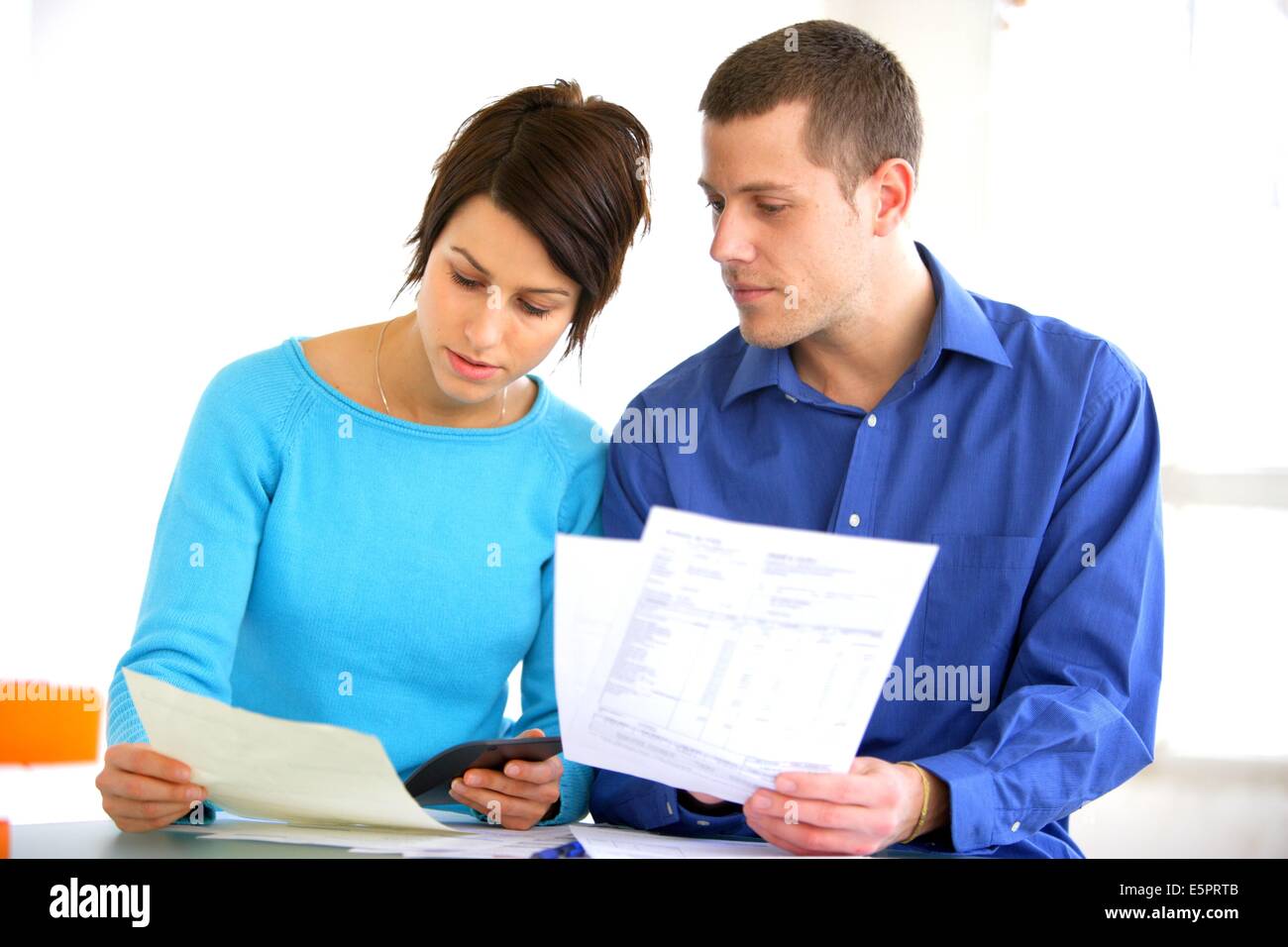 Young couple doing administrative work Stock Photo - Alamy