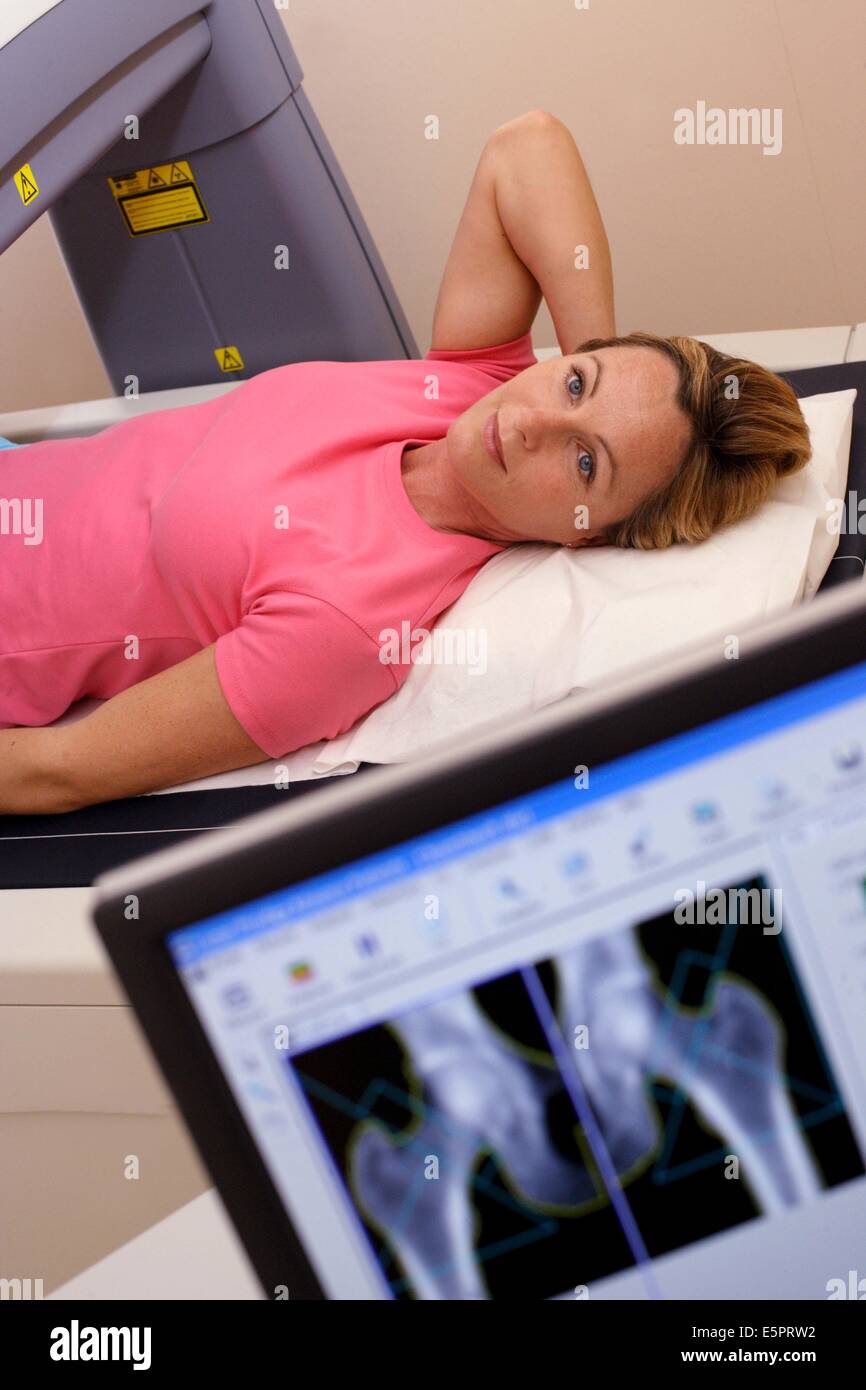 A Doctor Uses A Bone Densitometer To Measure The Optical Density Of The 