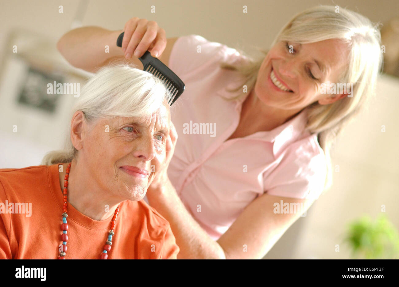 Carer home dressing hi-res stock photography and images - Alamy