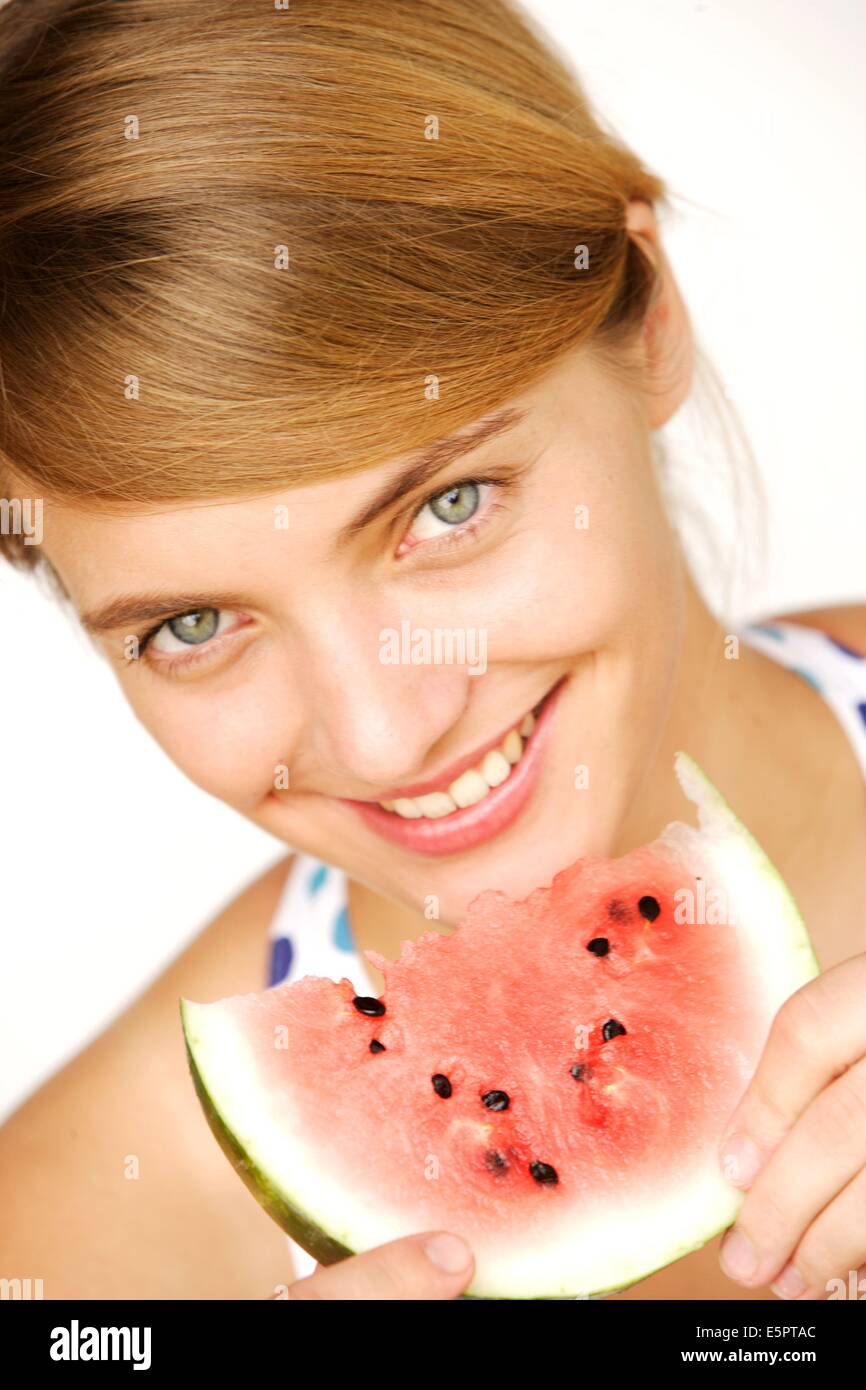 Woman eating watermelon Stock Photo - Alamy