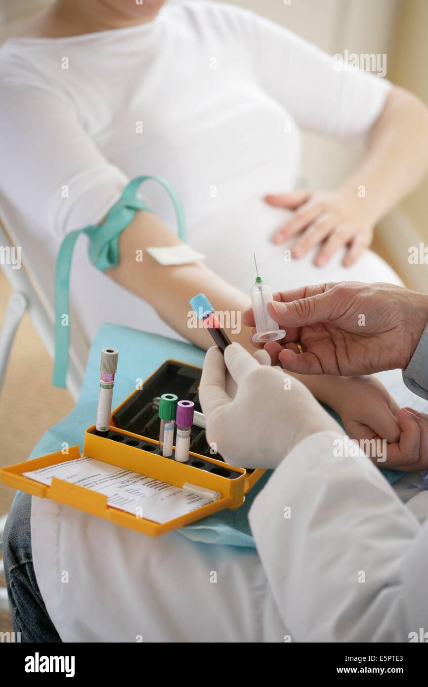 Doctor taking a pregnant woman's blood sample Stock Photo - Alamy