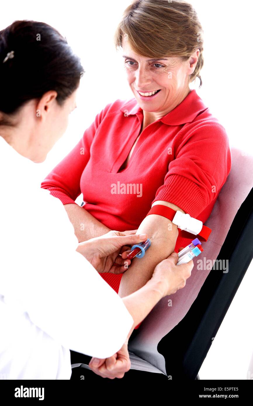 Doctor taking a 50-year-old woman's blood sample Stock Photo - Alamy