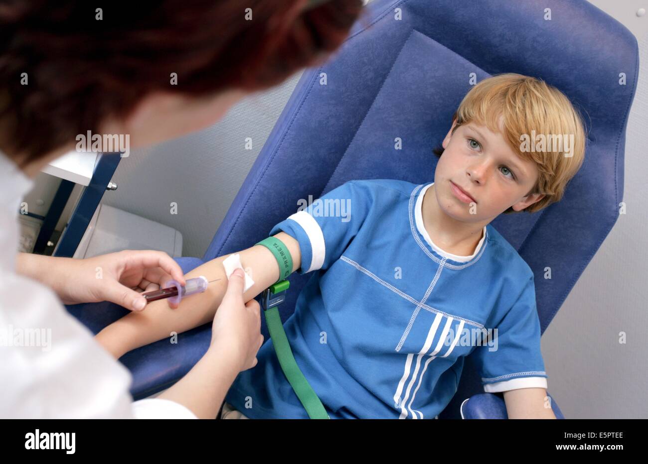 Nurse taking 8-year-old boy's blood sample Stock Photo - Alamy