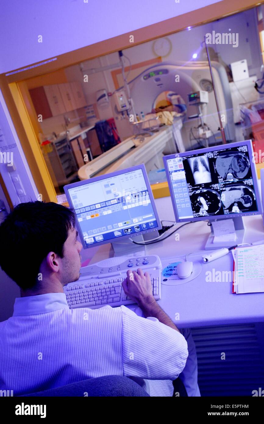 Patient undergoing 3D Computed Tomography (CT) scan of the heart with a ...