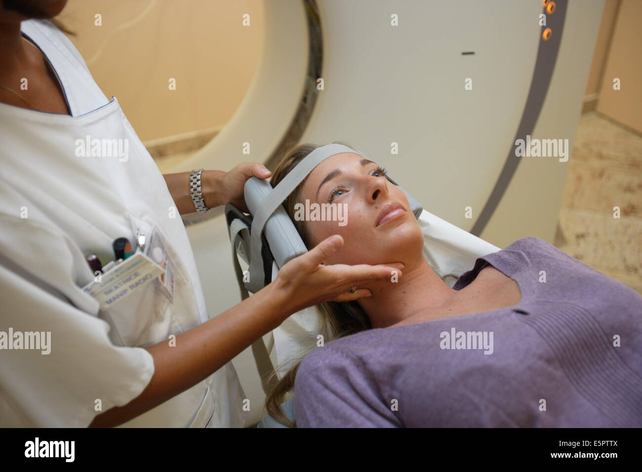 Patient undergoing a Computed Tomography (CT) scan of the brain Stock ...