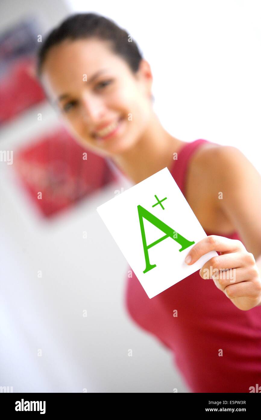 Woman holding a card of her blood group, A, Rhesus (Rh) positif Stock ...