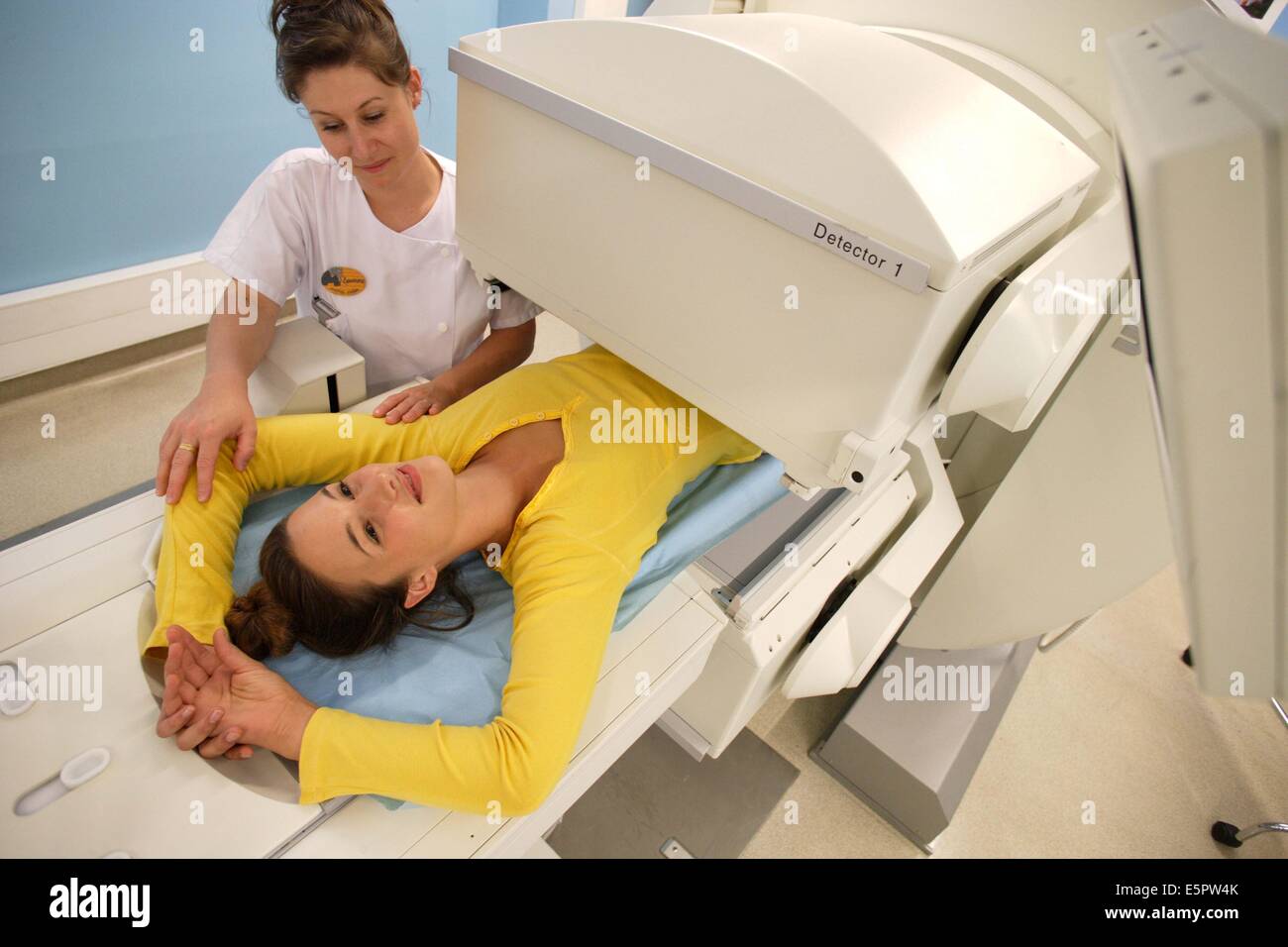 Young woman undergoing a gamma scan examination of her bones at the ...