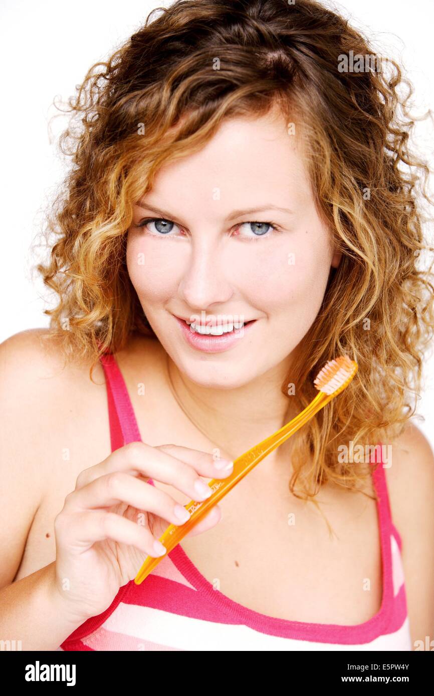 Woman with toothbrush Stock Photo - Alamy
