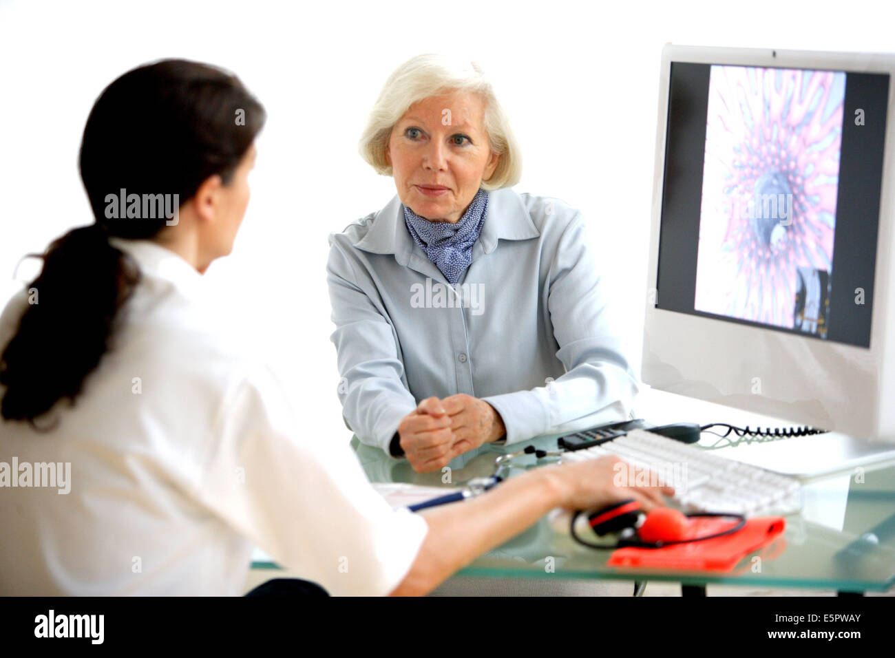 Doctor showing a female patient virtual endoscopy of a stent vascular ...