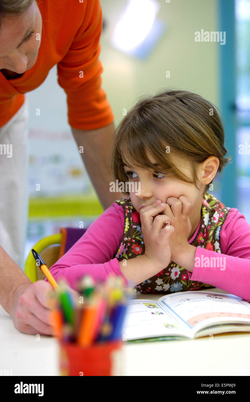 6 year old girl at school with teacher Stock Photo - Alamy