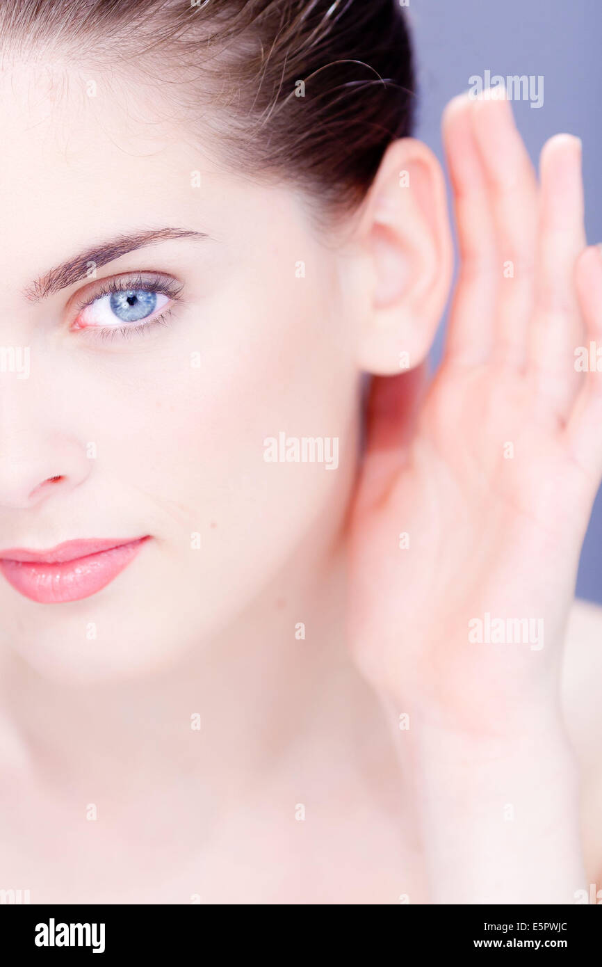 Woman holding hand to ear pain hi-res stock photography and images - Alamy