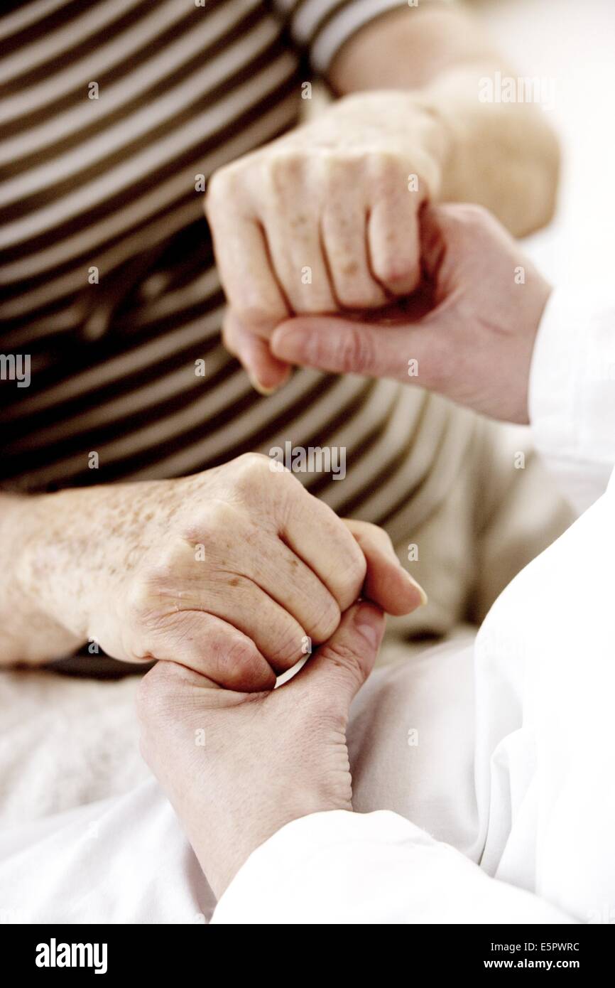 Holding hands of elderly person Stock Photo - Alamy