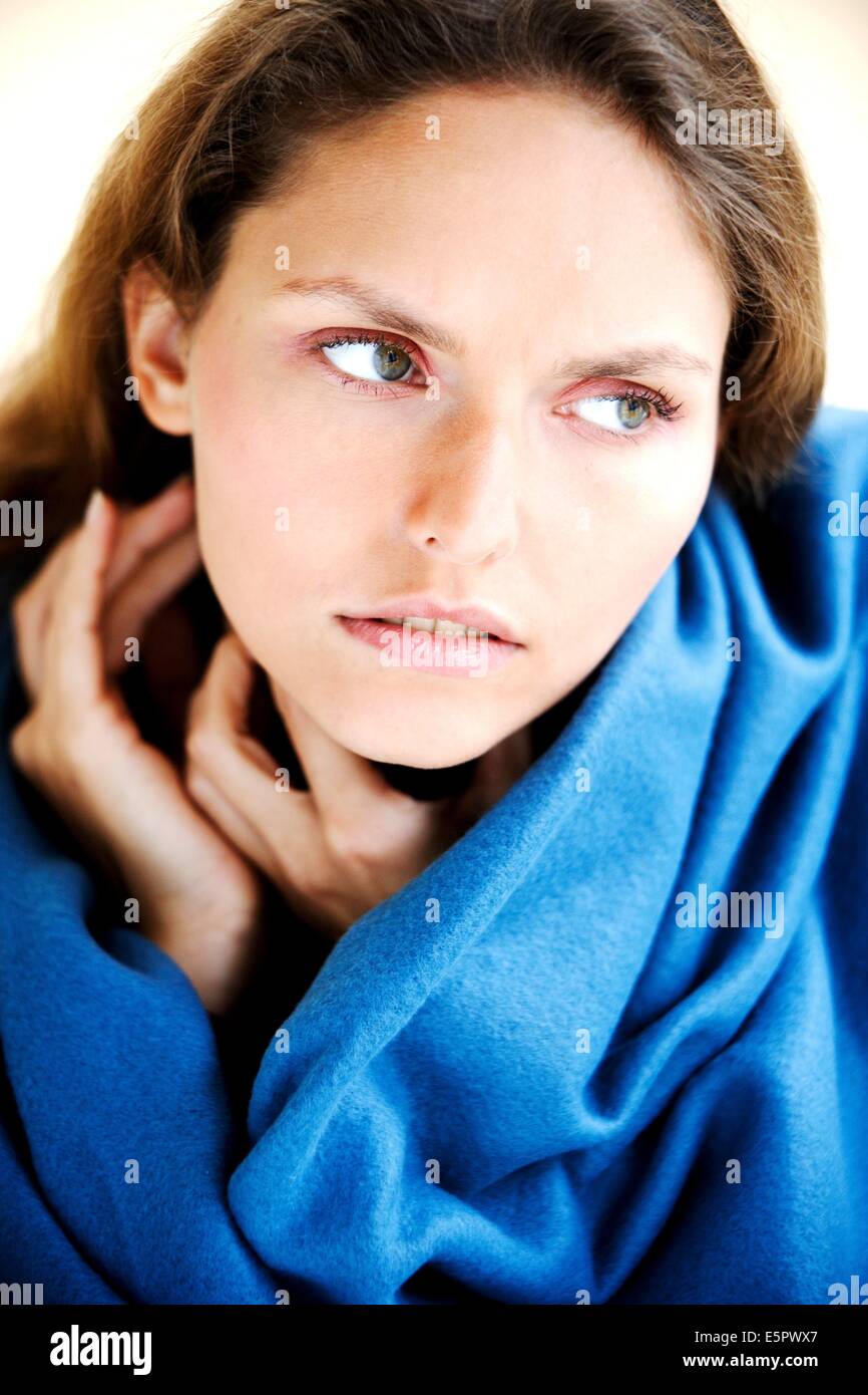 Woman wrapped on a blue blanket Stock Photo - Alamy