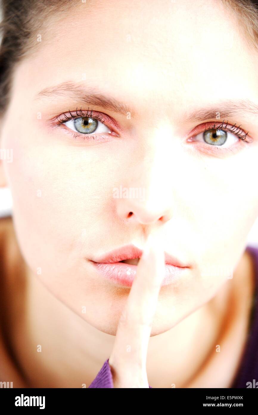Woman signing to be silent Stock Photo - Alamy