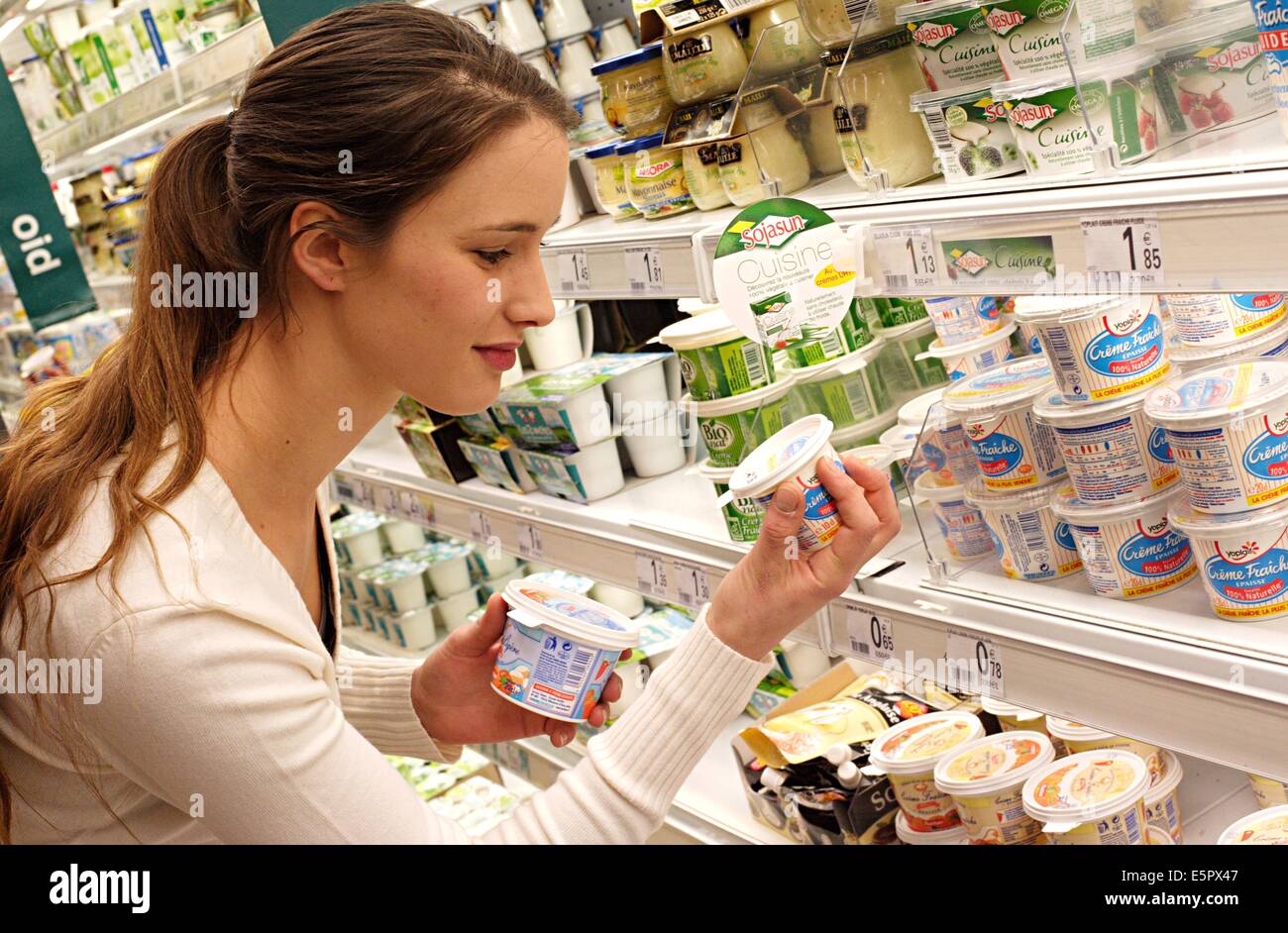 Woman shopping in the organic food section in supermarket Stock Photo ...