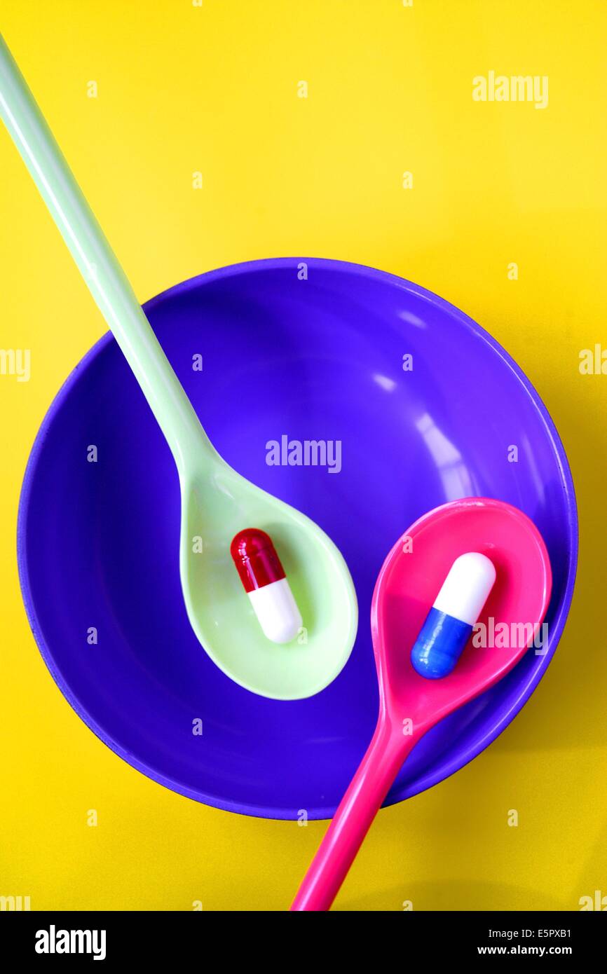Drug capsules on spoon Stock Photo - Alamy