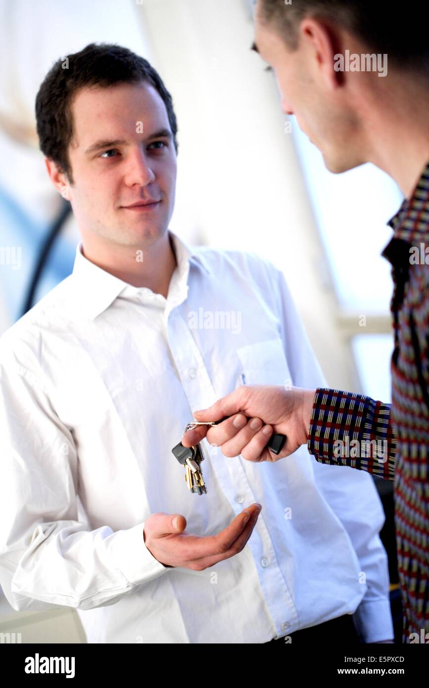 Man receiving keys Stock Photo - Alamy
