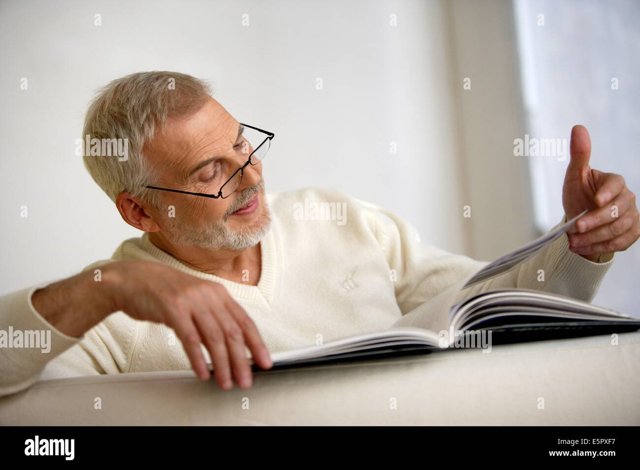 Man reading book Stock Photo - Alamy