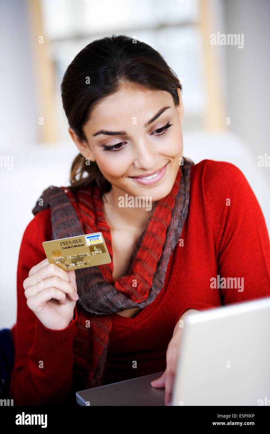Woman using credit card for online purchases Stock Photo - Alamy