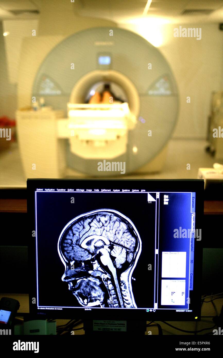 Patient undergoing a MRI (Magnetic Resonance Imaging) of the brain ... Patient undergoing a MRI (Magnetic Resonance Imaging) of the brain ...