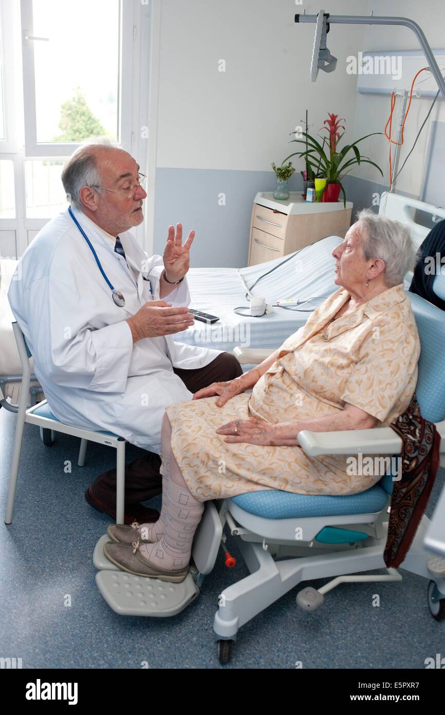 Elderly patient in consultation with a gerontologist; Residential home ...