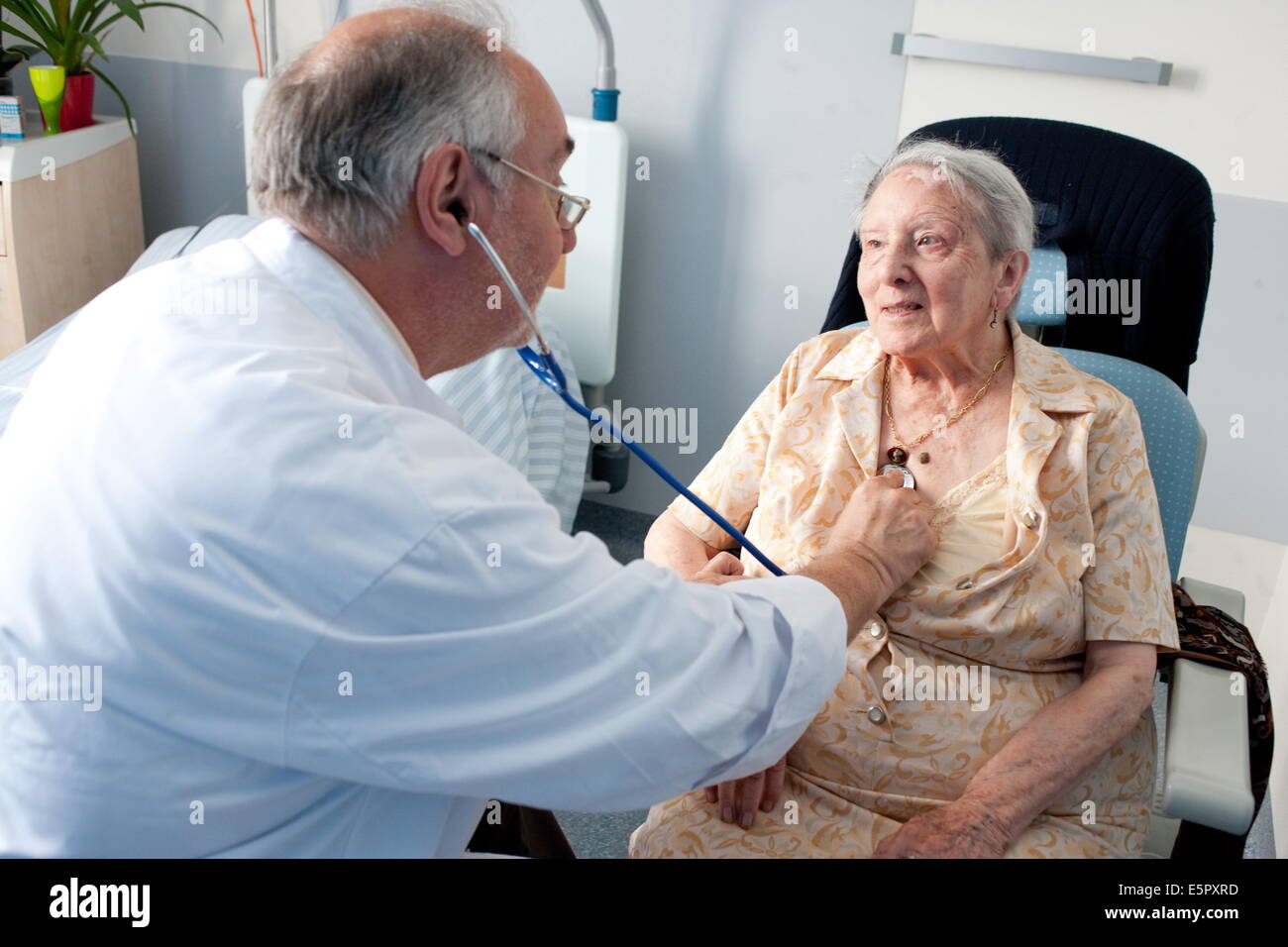 Elderly patient in consultation with a gerontologist; Residential home ...