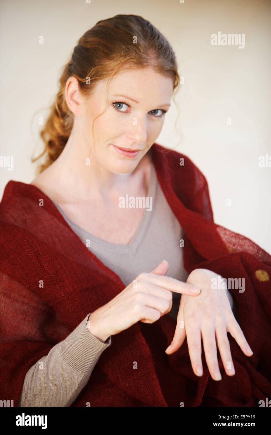 Woman inspecting her hands Stock Photo - Alamy