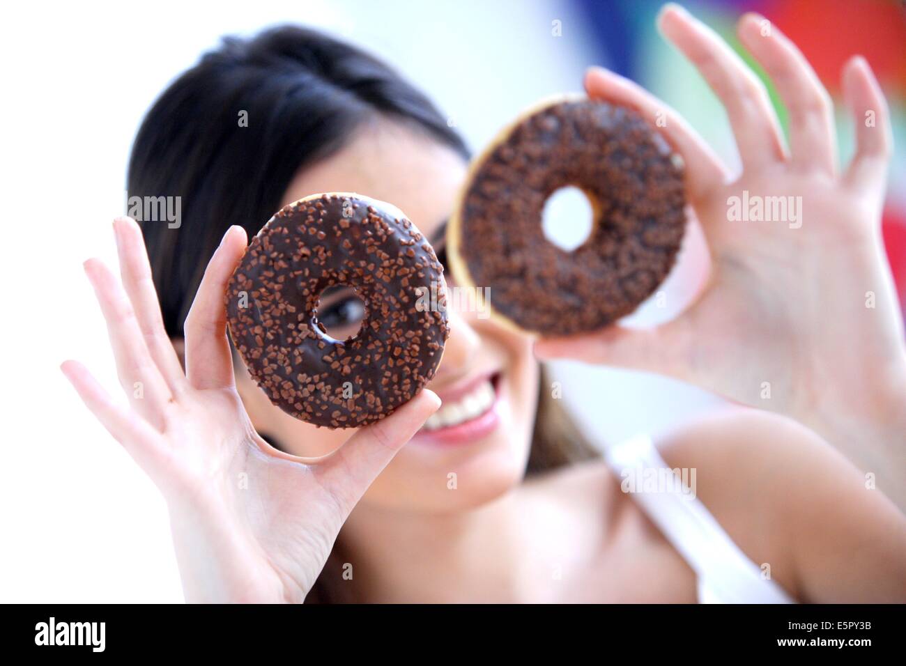 Woman eating cookies Stock Photo - Alamy