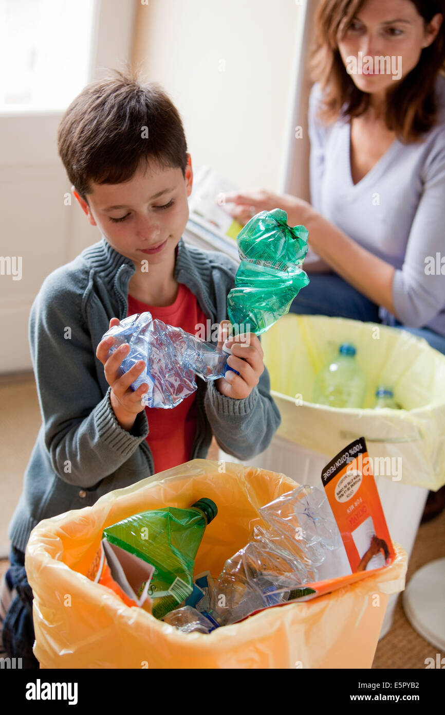 Boy sorting recycled wastes Stock Photo - Alamy