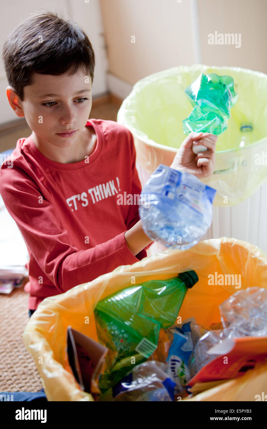 Boy sorting recycled wastes Stock Photo - Alamy