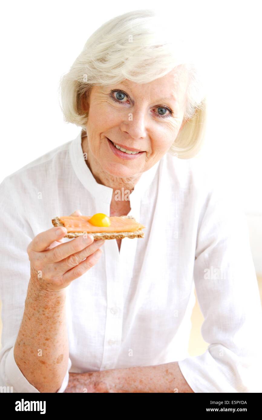Elderly eating fish food not child hi-res stock photography and images ...