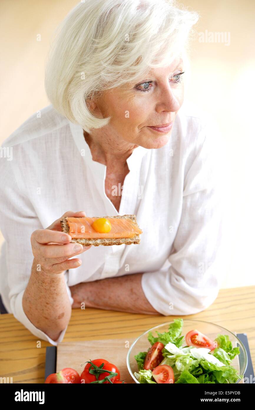 Elderly eating fish food not child hi-res stock photography and images ...