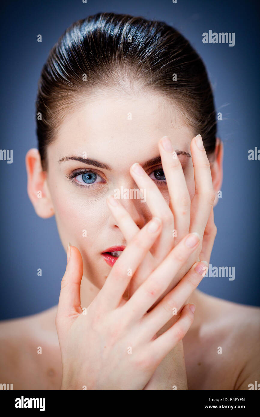 Woman hiding her face Stock Photo - Alamy
