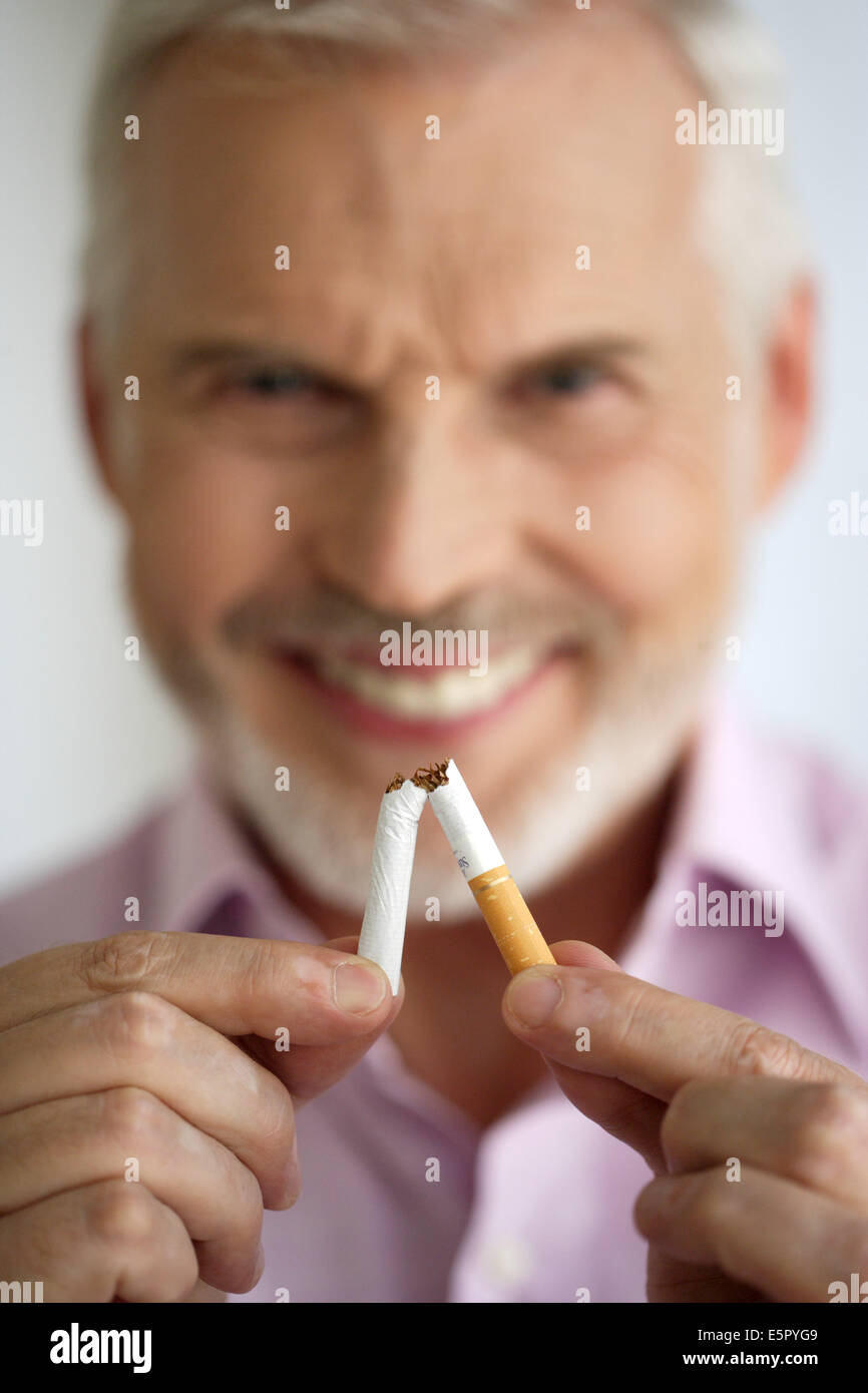 Man wishing to quit smoking Stock Photo - Alamy