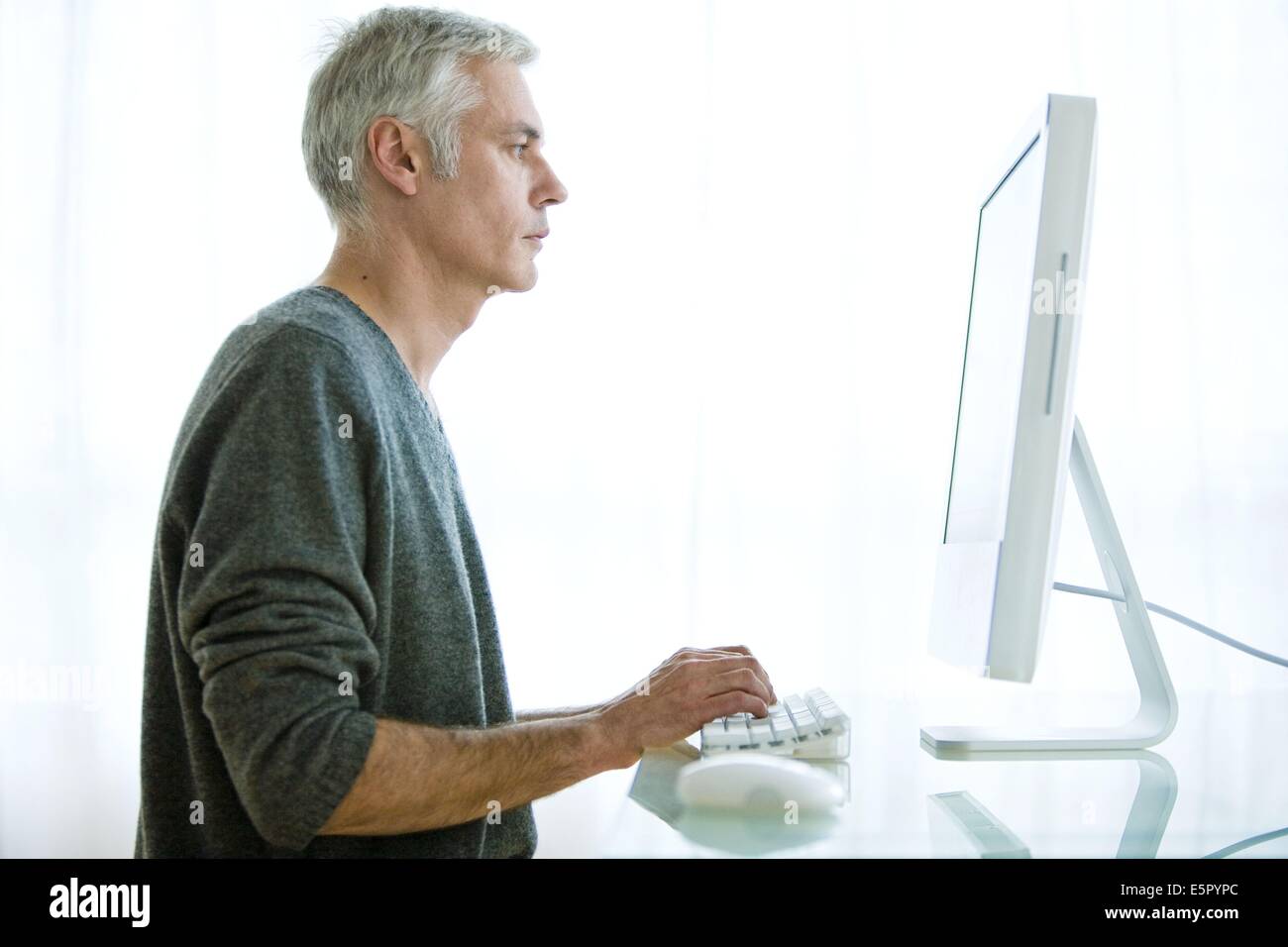 Man using computer Stock Photo - Alamy