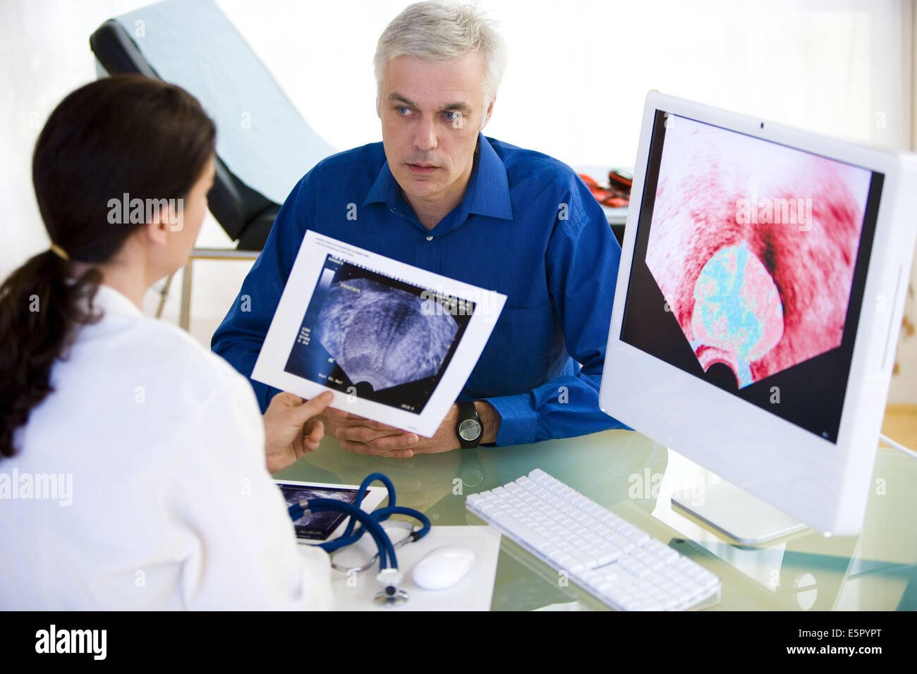 Doctor discussing prostate ultrasound scan with a patient Stock Photo ...