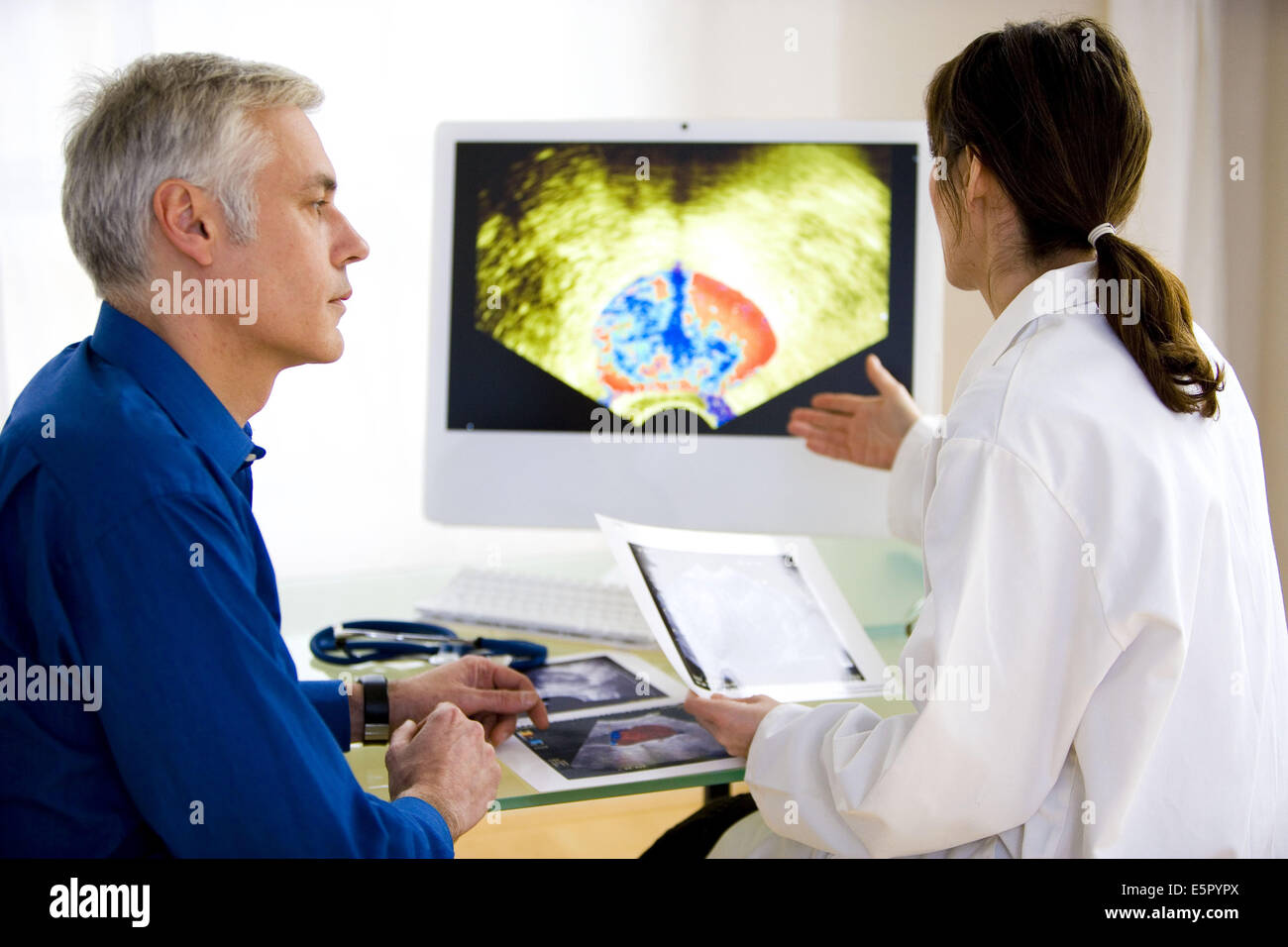 Doctor discussing prostate ultrasound scan with a patient Stock Photo ...