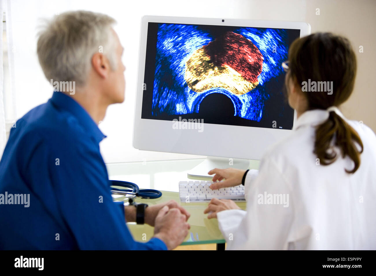 Doctor discussing prostate ultrasound scan with a patient Stock Photo ...