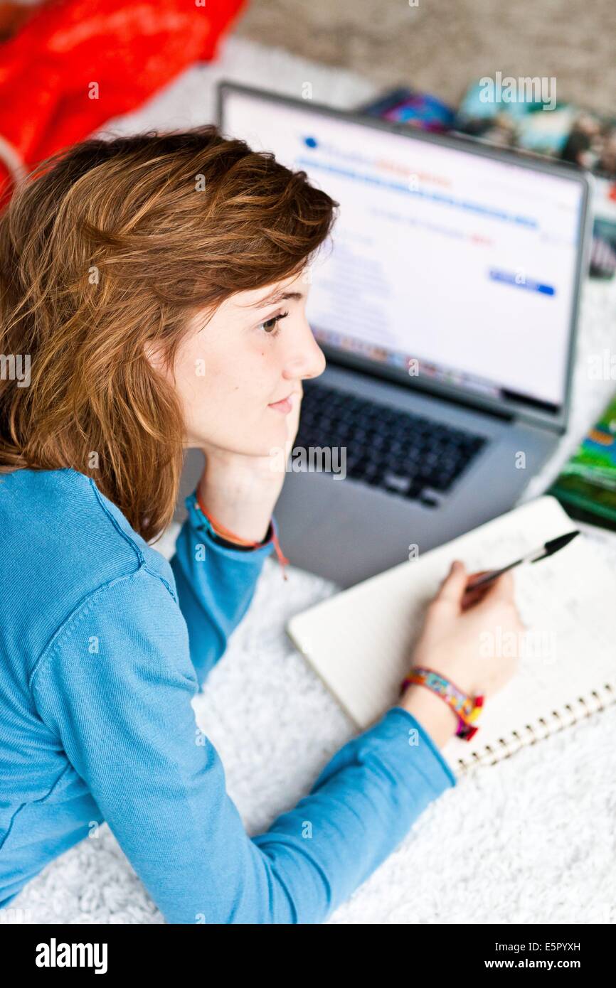 Teenage girl using a laptop Stock Photo - Alamy