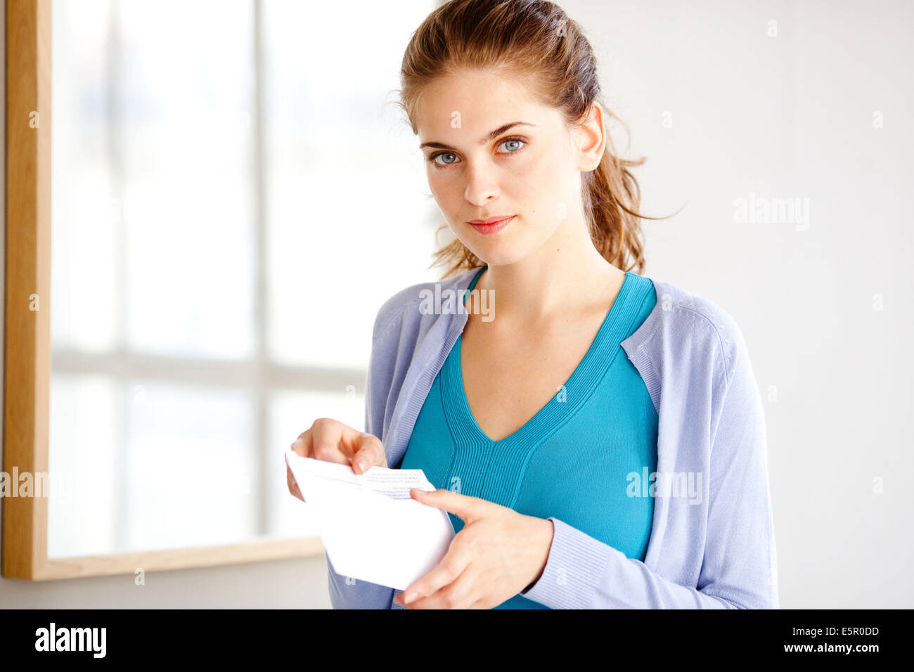 Old woman looking at letter hi-res stock photography and images - Alamy