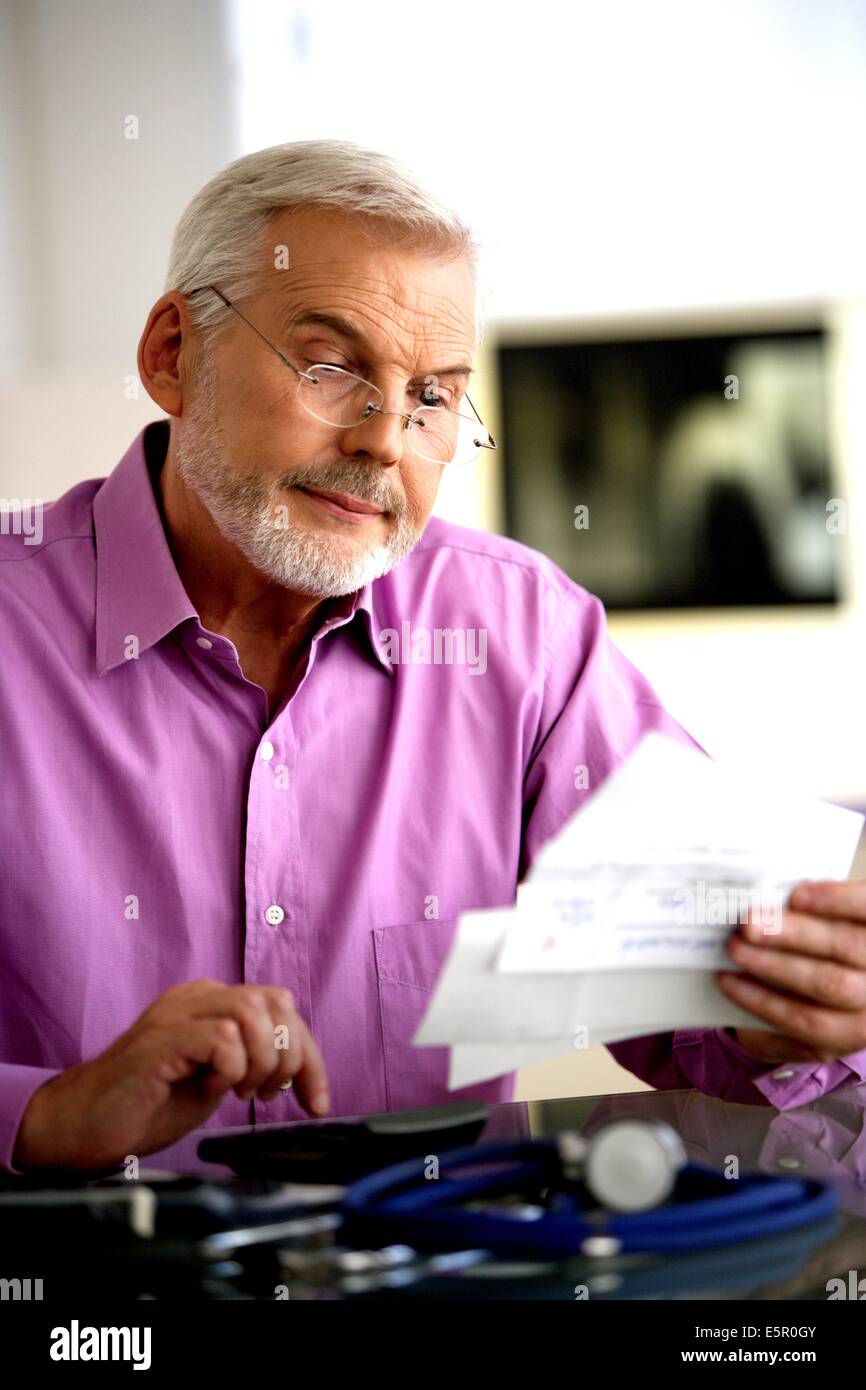 Man doing accounting and administrative work Stock Photo - Alamy
