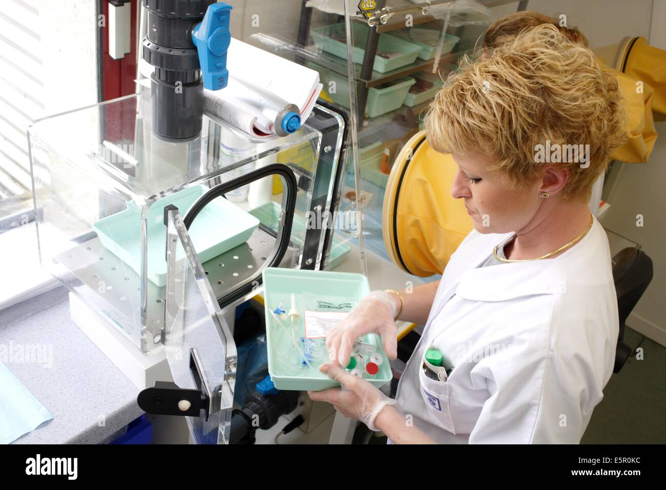 Oncology department, A compounder is preparing chemotherapy treatments ...