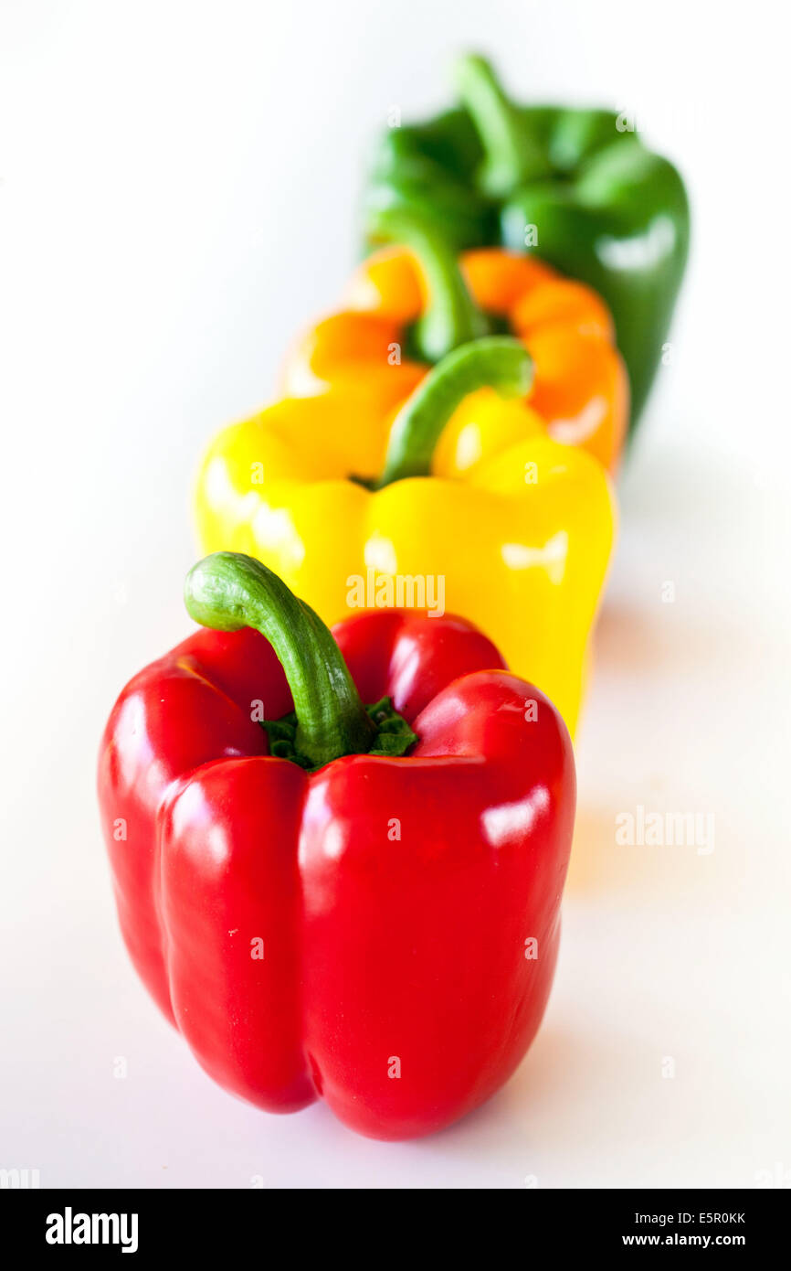 Green, yellow orange and red bell peppers Stock Photo - Alamy