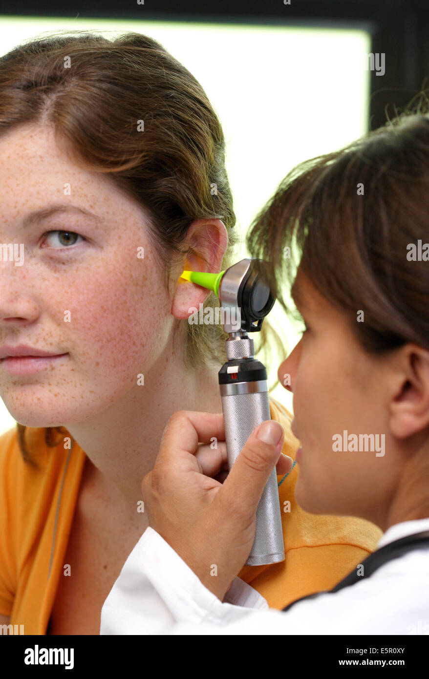 Nose and throat examination otoscope hi-res stock photography and ...
