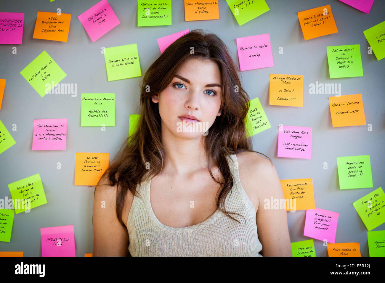 Woman surrounded by post-it ® notes Stock Photo - Alamy