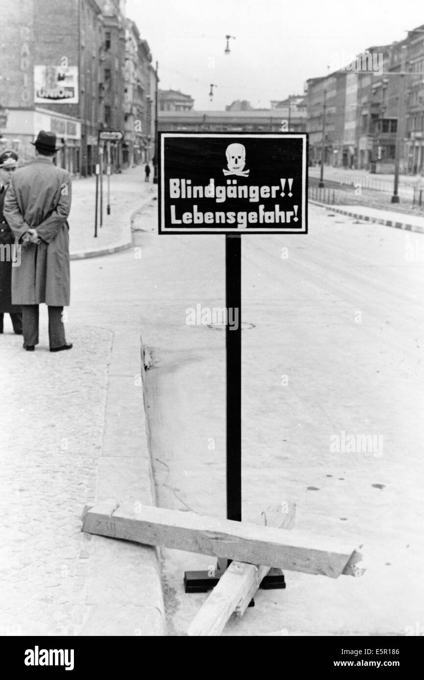 The picture from a Nazi news report shows a warning sign for unexploded ...